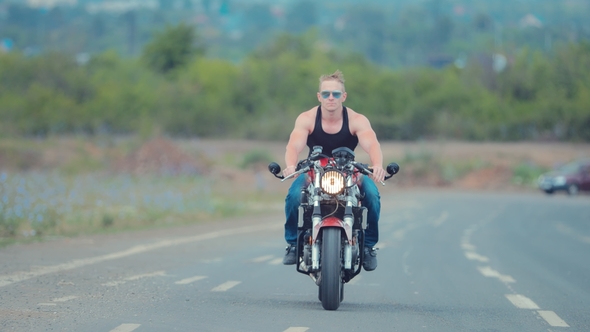 Biker Riding a Motorcycle on a Road, Stock Footage | VideoHive