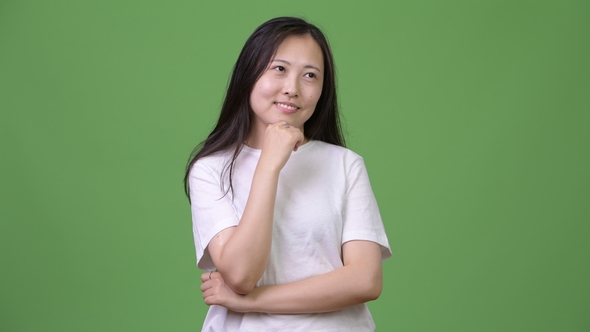 Young Happy Asian Woman Thinking, Stock Footage | VideoHive
