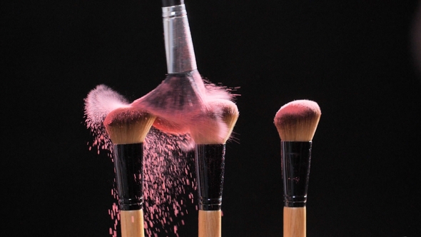 Make-up and Beauty Concept. Brush with Pink Powder Explosion on Black ...