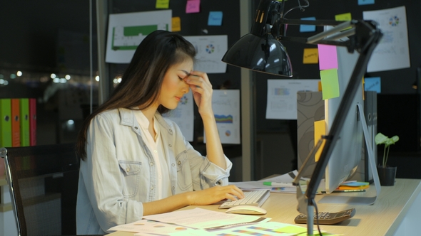 Female Office Worker Works Late Hours She's Alone on the Office Her ...