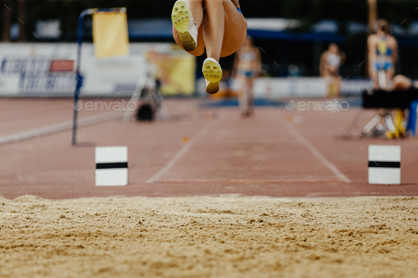 long jump woman legs athlete Stock Photo by realsportsphotos | PhotoDune