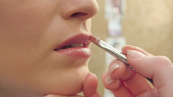 Makeup Artist Finishing Apply Lip Gloss and Young Model Smiling, Stock ...