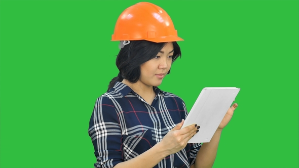 Asian Engineer Woman Using Tablet on a Green Screen, Chroma Key, Stock ...