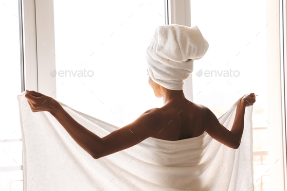 Back view of an attractive african woman Stock Photo by vadymvdrobot