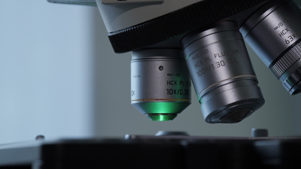 A Scientist Tunes a Microscope Lens, Stock Footage | VideoHive