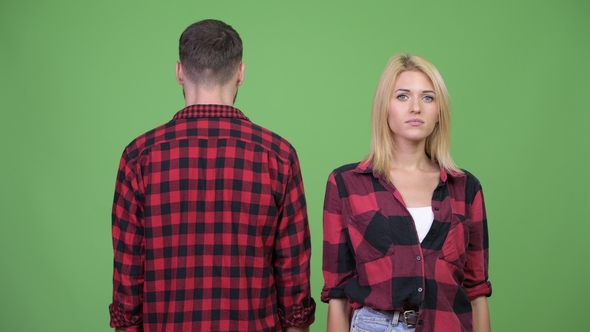 Young Man Turning Around and Smiling After Together with Young Woman ...
