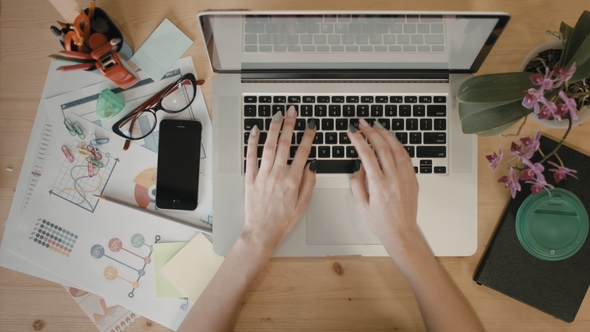 Young Journalist Is Typing an Article on a Laptop Top View, Stock Footage