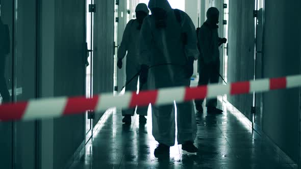 Inspectors Are Walking Along a Corridor and Sanitizing It During Covid ...