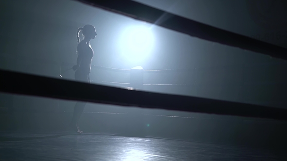 Girl Jumping Rope in a Dark Ring, Stock Footage | VideoHive