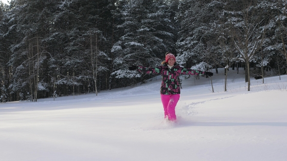 Woman Running Through A Deep Snowdrift In The Winter In Field And ...