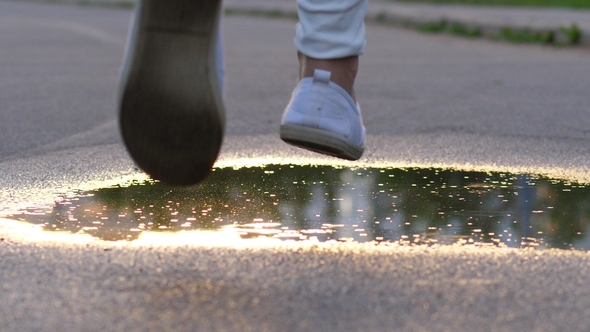 Woman Legs Run and Step in Puddle, Water Splash, Stock Footage | VideoHive