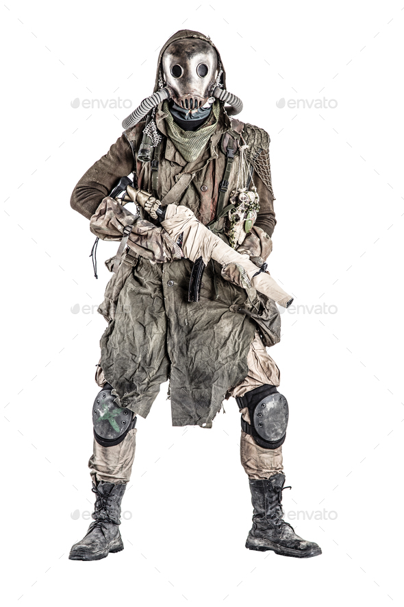 Post apocalyptic creature in gas mask armed by gun Stock Photo by ...
