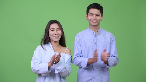 Young Asian Business Couple Clapping Hands Together, Stock Footage
