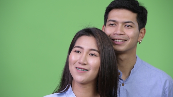 Young Happy Asian Business Couple Thinking Together, Stock Footage