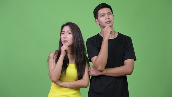 Young Asian Couple Thinking Together, Stock Footage | VideoHive