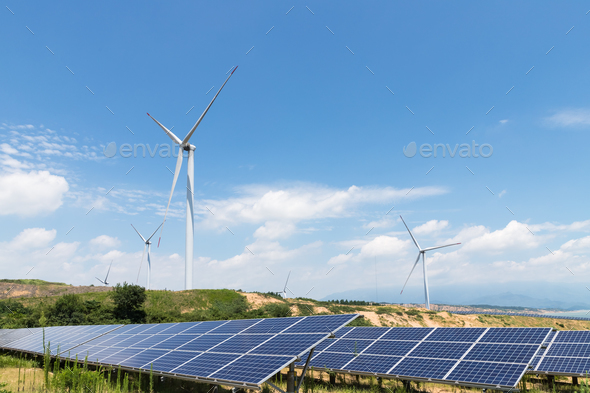 renewable energy landscape, solar panels and wind turbines with blue ...