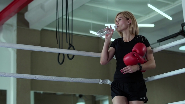 Woman Stand at Boxing Ring and Drink Water, Stock Footage | VideoHive