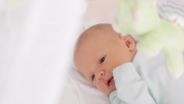 Sleepy Newborn Baby and Spinning Crib Mobile, Stock Footage | VideoHive
