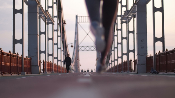 Slim Senior Female Running Across Bridge in City, Stock Footage | VideoHive