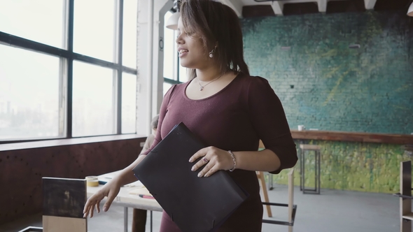 Young African Team Leader Walking Through Modern Office and Controls ...