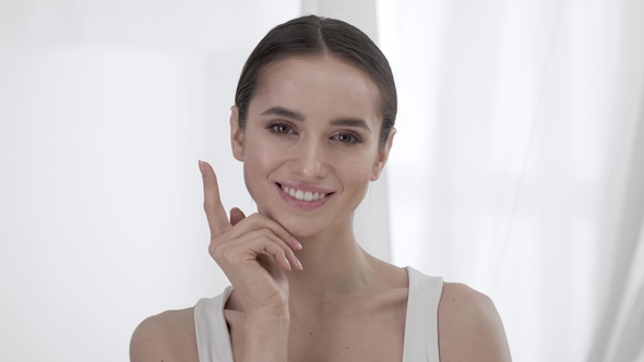 Beauty Skin. Attractive Woman Touching Face By Fingers Portrait, Stock ...