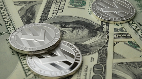 Litecoin LTC Coins Rotating on Bills of 100 Dollars, Stock Footage