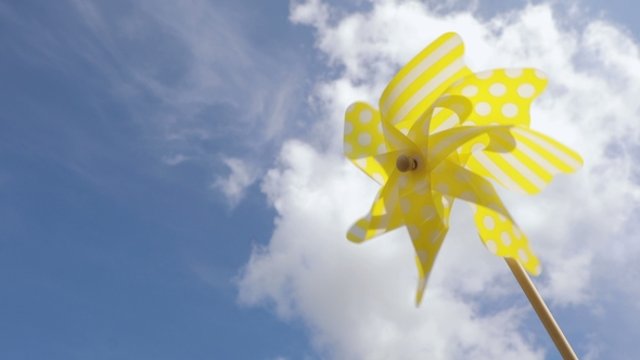 Yellow Pinwheel Toy Against Blue Sky. Summer Concept, Stock Footage