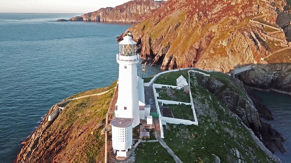 Aerial View of South Stack with Lighthouse and Cliffs During Sunset ...