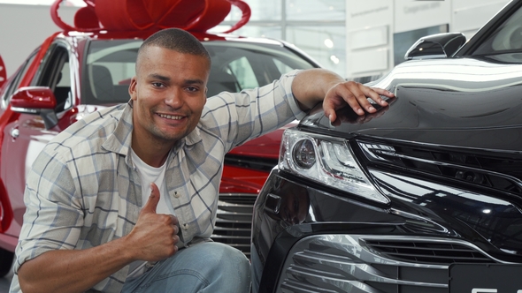 Handsome African Man Showing Thumbs Up While Examining New Car, Stock ...