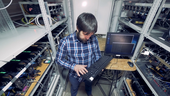 One Man at a Mining Farm, Stock Footage | VideoHive