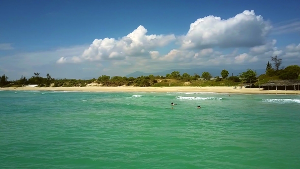 Motion Along Ocean Surf Line Past Beach To Surfer Figures, Stock Footage
