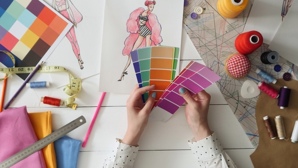 Female Fashion Designer Choosing Color Palette for Her New Design ...