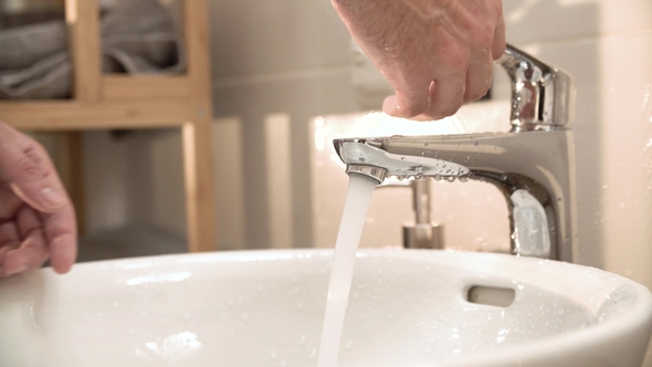 Of Hands Turn On Running Water In Sink In Bathroom, Stock Footage ...
