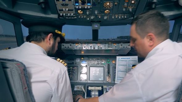 Aviation Specialist Is Instructing Another Pilot Before the Flight in ...