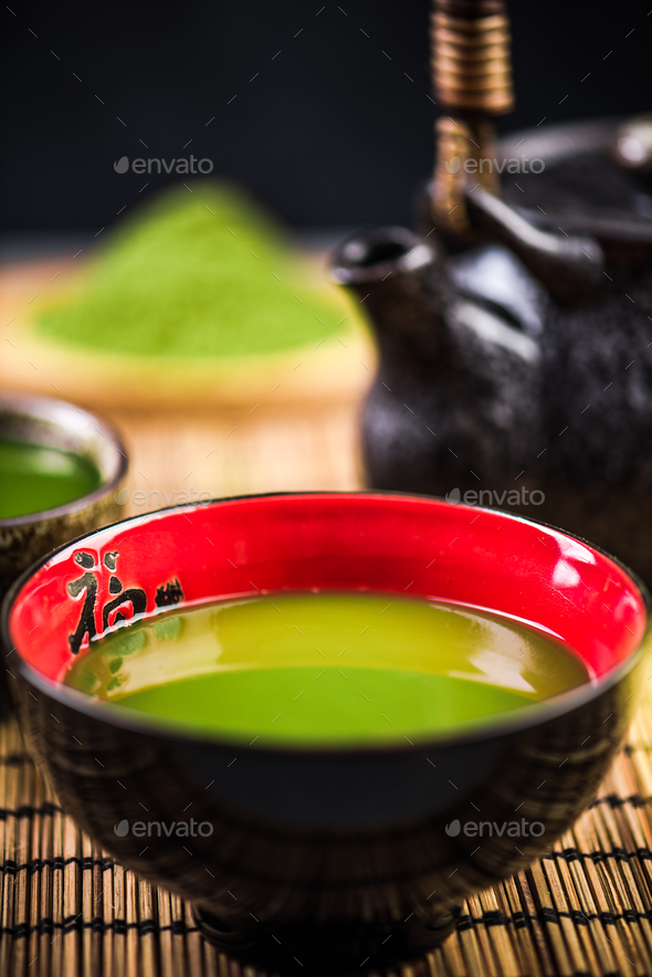 Green Matcha tea in dark ceramic pot Stock Photo by merc67 | PhotoDune