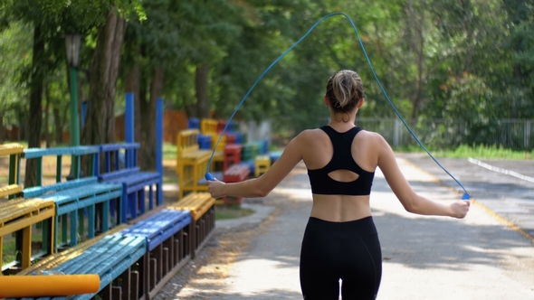 Back View on Young Athlete Woman in Comfortable Sport Outfit Jumping ...
