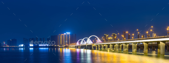 beautiful jiujiang night view of lake and bridge in new district ...