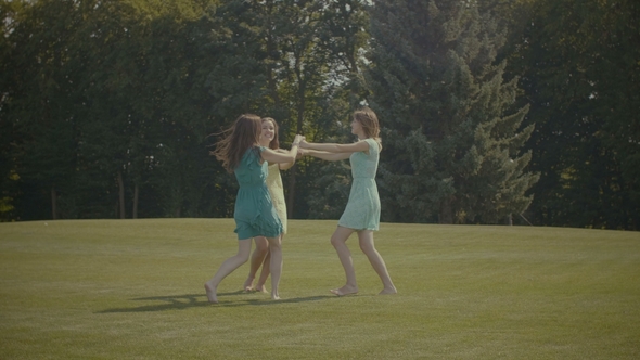 Cheerful Beautiful Girls Dancing in Green Field, Stock Footage | VideoHive