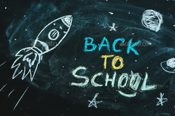 Space rocket doodle drawing on chalkboard, back to school Stock Photo ...