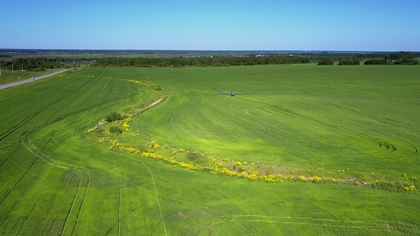 Small Gully Among Green Fields with Machinery, Stock Footage | VideoHive