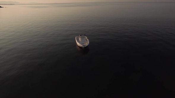 Aerial View of Empty Boat in Quiet Sea at Sunset, Stock Footage | VideoHive