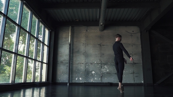 Ballet Dancer. Young Man Gracefully Dancing on a Dark Background in the ...
