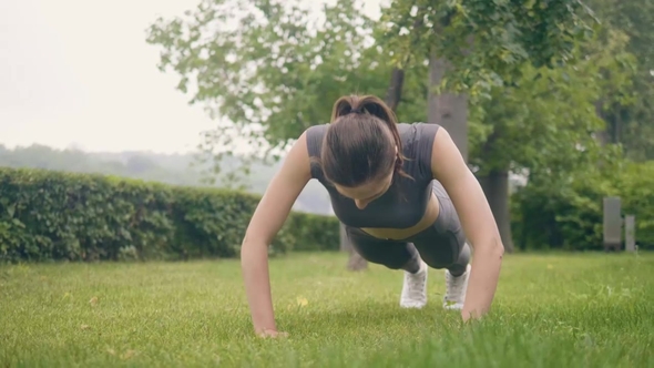 Fitness Girl Doing Push Ups Exercises During Outdoor Training in Summer ...