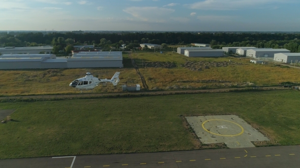 Aerial View of a Private Helicopter Flying Over the Airport, Stock Footage