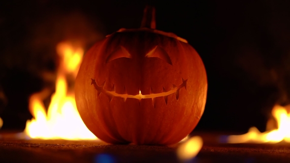 Smiling Happy Carved Halloween Pumpkin Against of Fiery Explosion ...