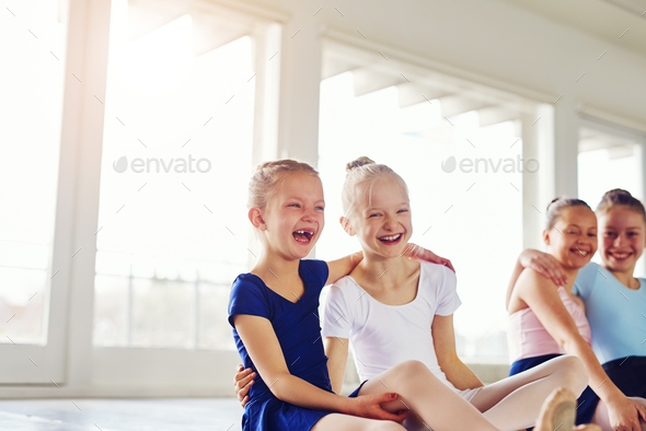 Little ballerinas having fun and embracing in ballet class Stock Photo ...