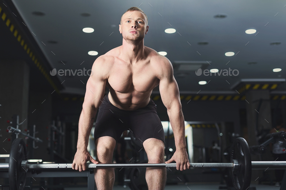 Muscular bodybuilder doing heavy deadlifts at gym Stock Photo by ...