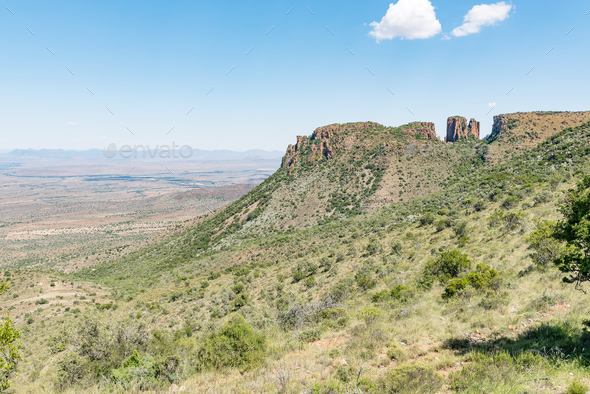 Dolerite columns with the Valley of Desolation Stock Photo by dpreezg