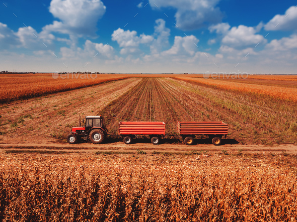 Aerial view of agricultural tractor with cargo carts in field Stock ...