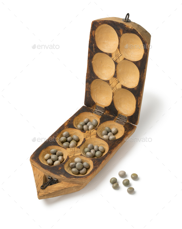 Traditional African oware game with seeds Stock Photo by picturepartners